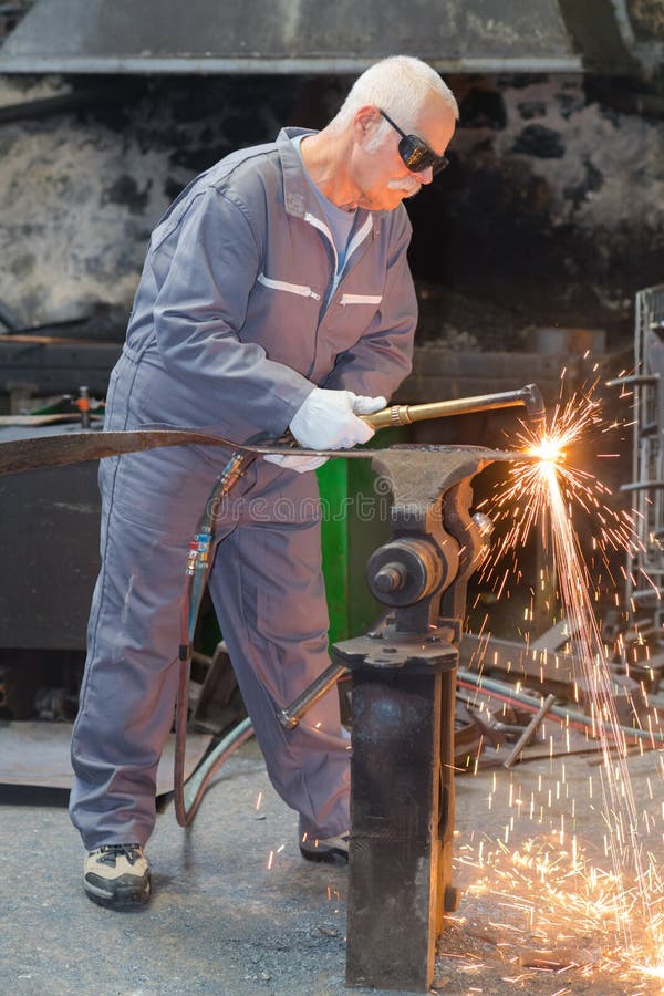 Old welder perfecting work stock photo. Image of male - 95054122