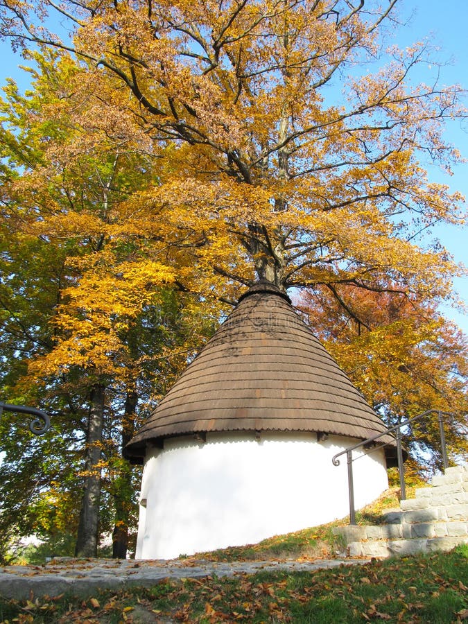 Old well and yellow tree stock photo. Image of build - 61687220