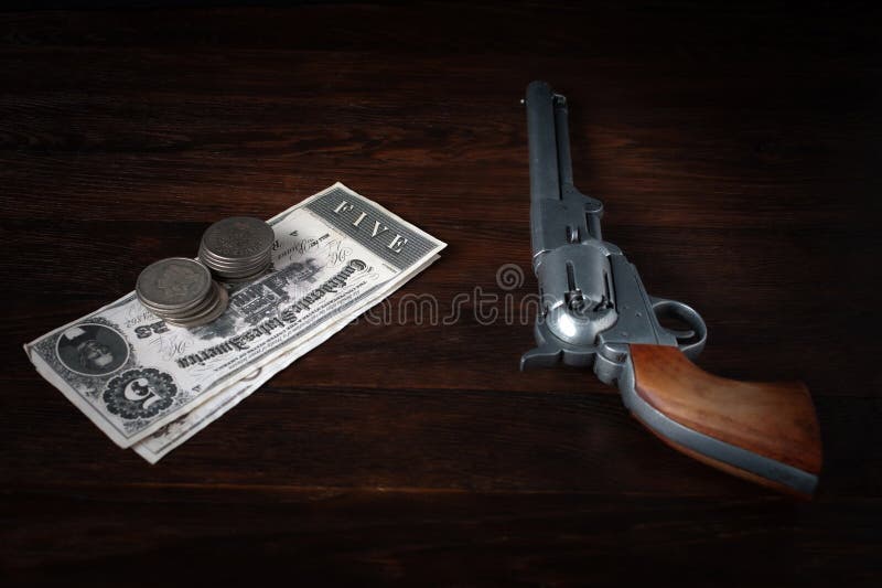 Old West Revolver with Cartridge and Silver Dollar Stock Photo - Image ...