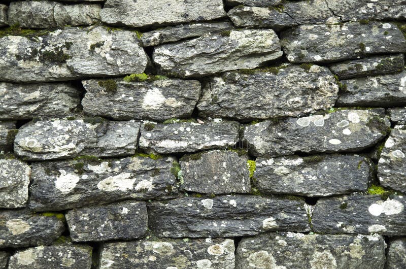 Old wet stone wall closeup stock image. Image of brown - 81108665