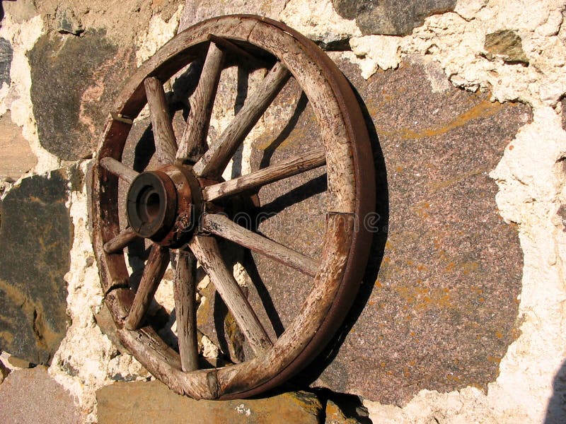 Old wheel stock image. Image of granite, barn, wall, stone - 194525