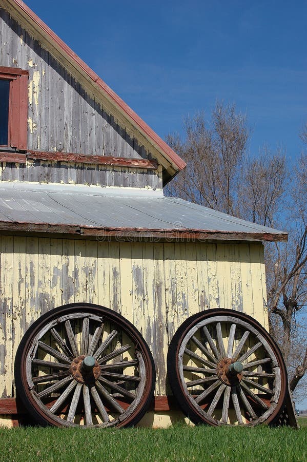 Old wheel on a barn stock photo. Image of skies, barn - 1103056
