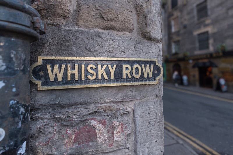 Old Whisky Row Road Sign on a Wall Stock Photo - Image of label, sign ...
