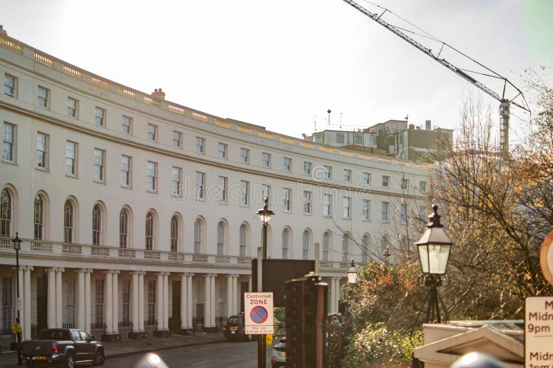 An Old White Building with Lamps and Glass Windows Editorial Stock ...