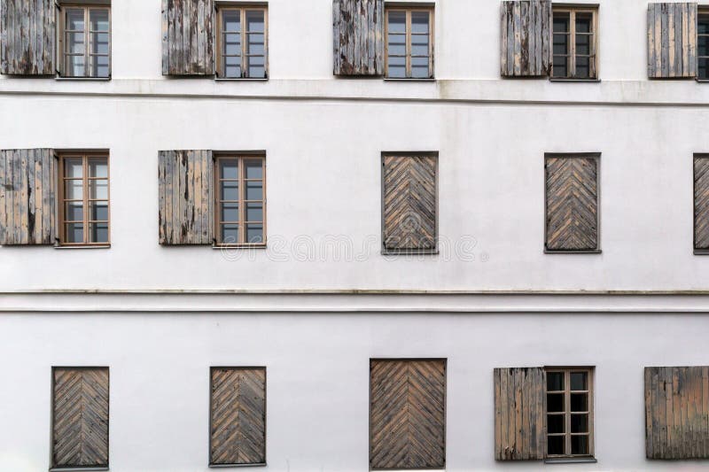 Old White Building Wall with Many Horizontal Windows and Wooden ...