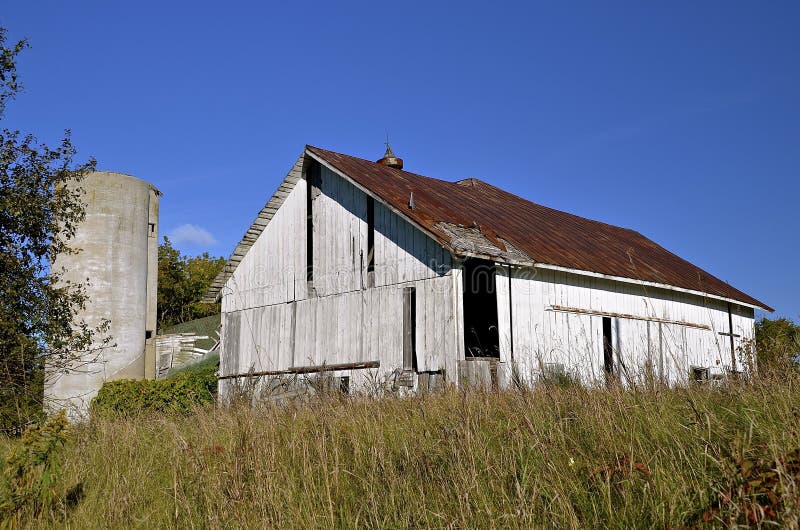 Old White Deteriorating Barn and Silo Stock Photo - Image of fence ...