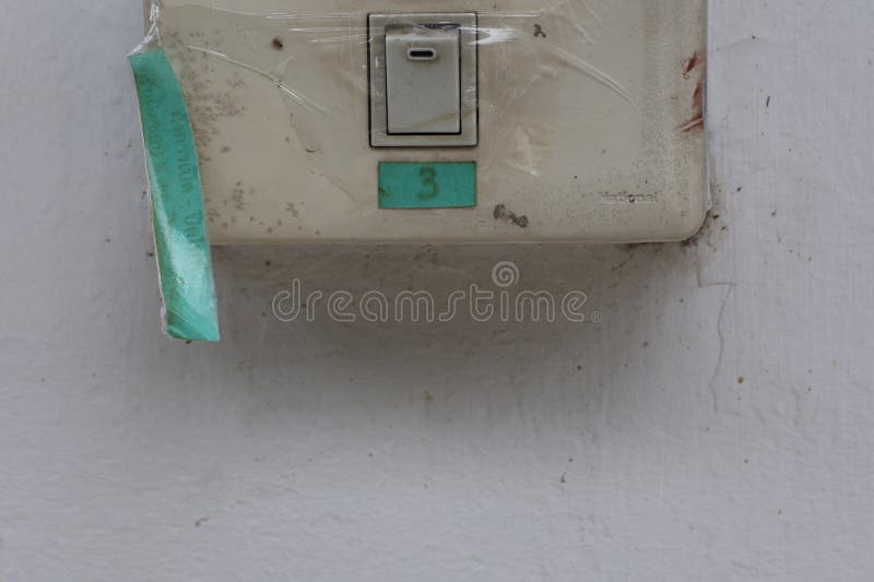 The Old White Electric Light Switch is Mounted on the Cement Wall ...