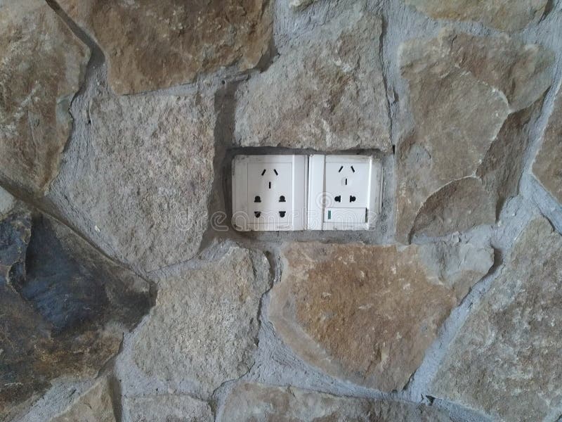 Old White Electrical Outlet on a Stone Wall with Copy Space for Text ...