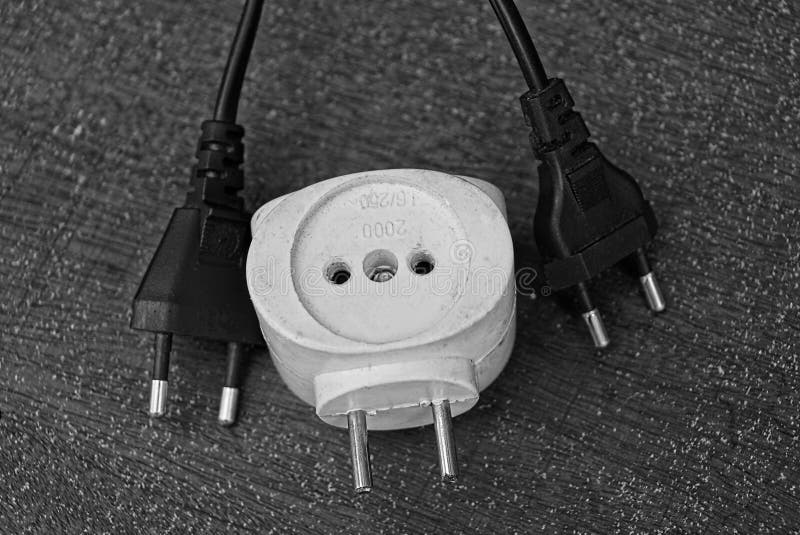 White Socket Adapter and Two Electrical Plugs on the Table Stock Photo ...