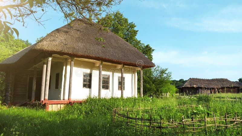 Old White Ukrainian Hut with Thatch Roof in the Settlement Stock ...