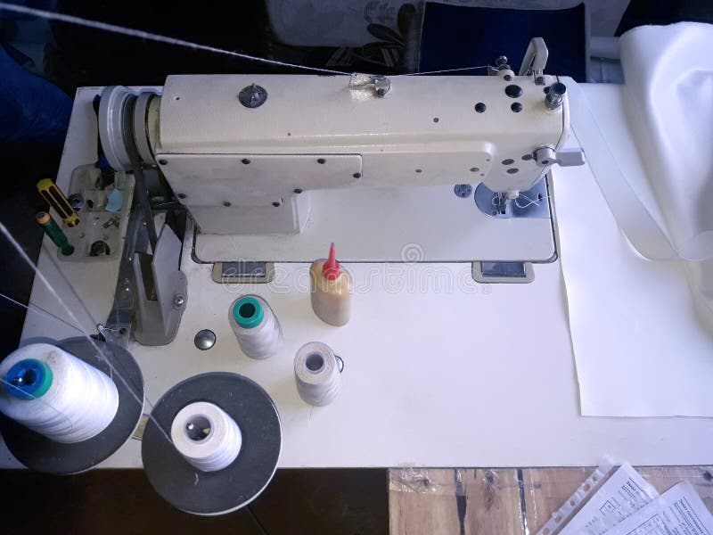 Old White Vintage Hand Sewing Machine. a Man is Sewing Stock Photo ...