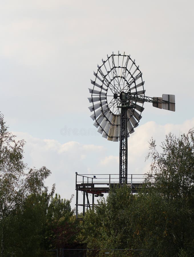 The Old Wind Generator Standing in the Industrial Zone Stock Image ...