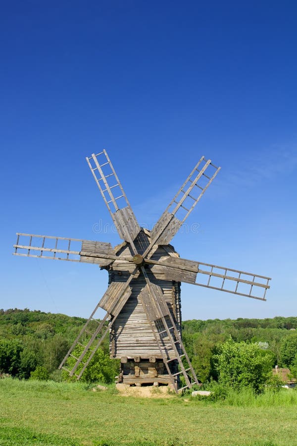 Old Wind Mill on a Spring Meadow with Blue Sky Stock Image - Image of ...