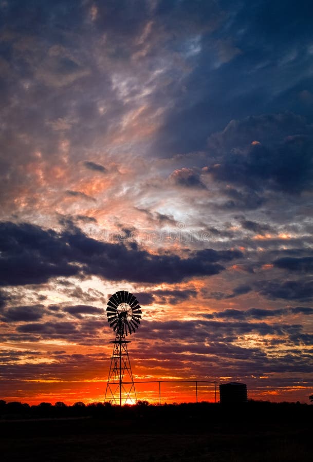 Old Wind Pump Using Sustainable Power at Sunset Stock Photo - Image of ...