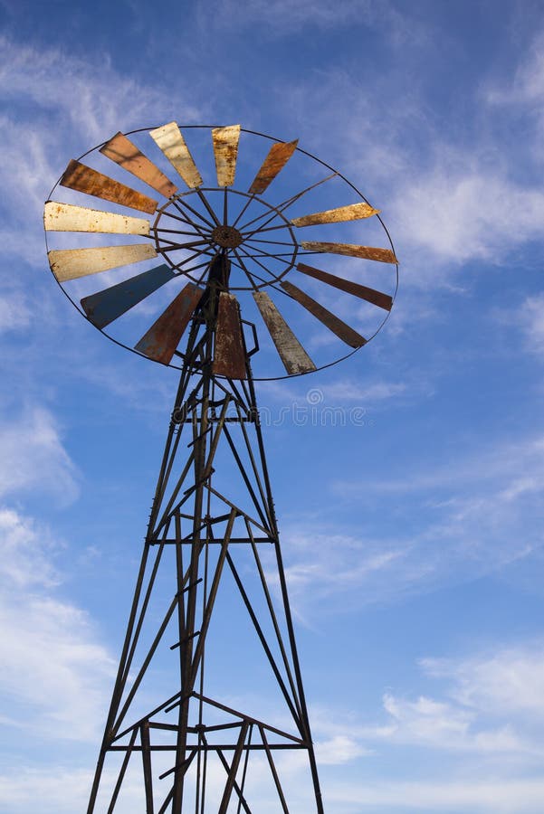 Old Windmill Against a Blue Sky with White Clouds, Close-up Stock Photo ...