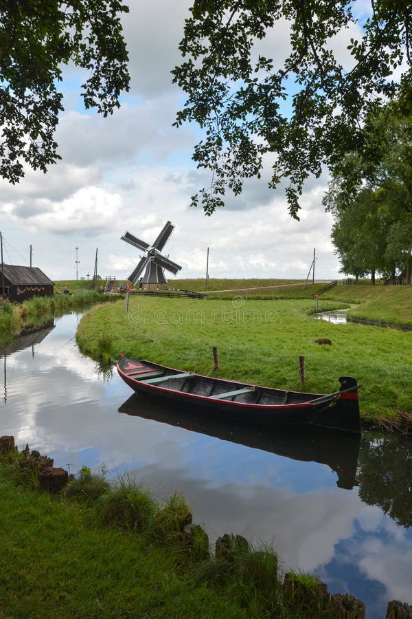 Windmill and boat stock image. Image of landscape, taking - 70955819