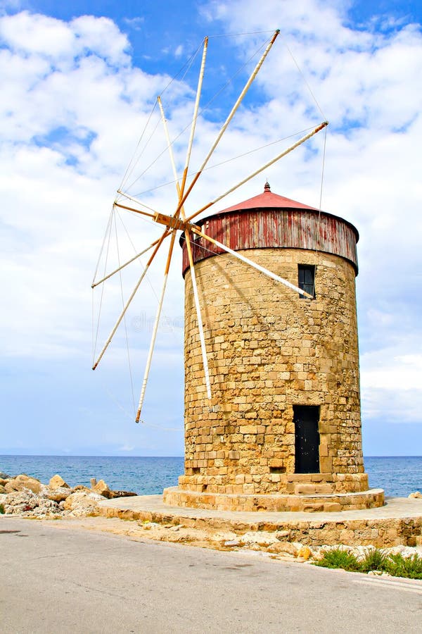 Windmills at Rhodes harbor stock photo. Image of tourism - 27479834