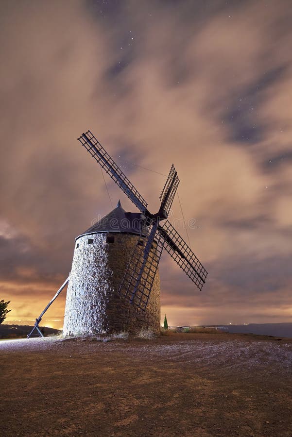 An Old Windmill in the Night with Clouds Stock Photo - Image of hill ...