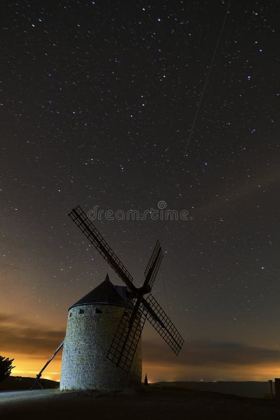 An Old Windmill in the Night with Clouds Stock Photo - Image of night ...