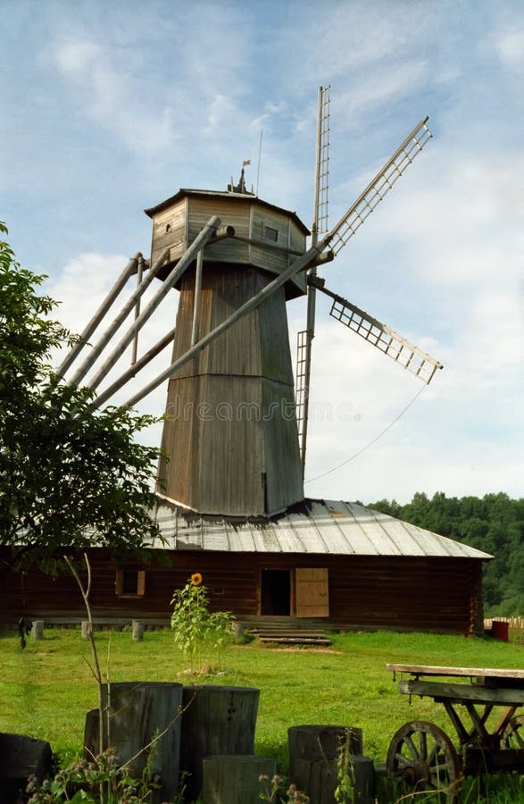 Old windmill at sunny day stock image. Image of grass - 12858475