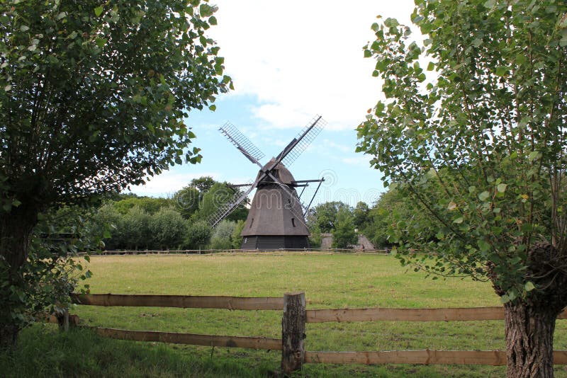 Old Windmill Surrounded by Green Trees in Denmark Stock Photo - Image ...