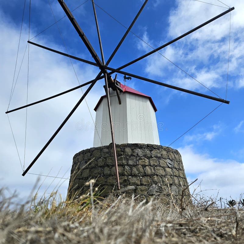 Old Windmill Under a Blue Sky Stock Image - Image of lighthouse ...