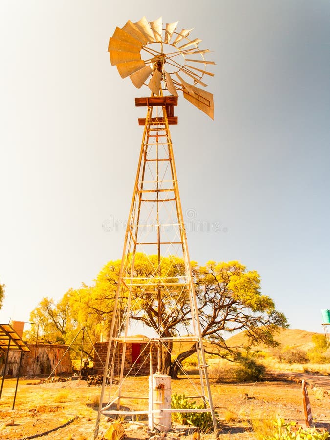 Old Windmill Water Pump in Dry Landscape. Metallic Tower Construction ...