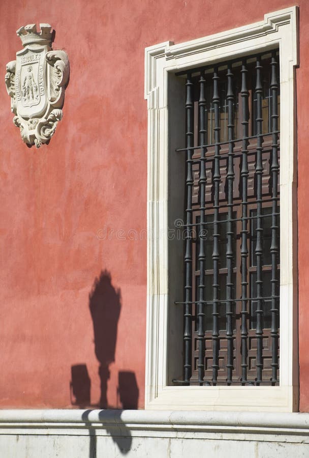 Old Window and Antique Shield in a Red Facade. Seville, Spain Stock ...