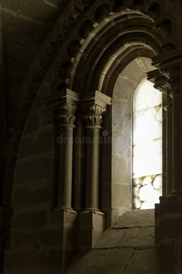 An Old Window in a Building with a Stone Arch Above it. Gothic Style ...