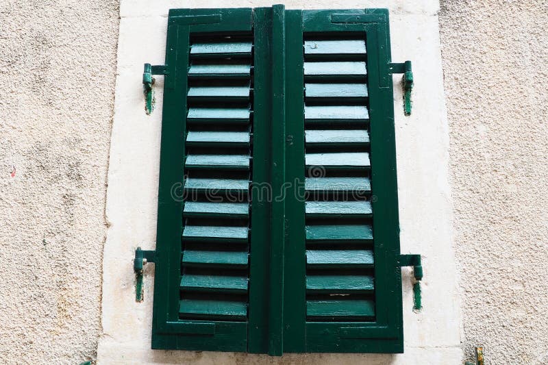 The Old Window with Green Closed Shutters on an Old House. Vintage ...