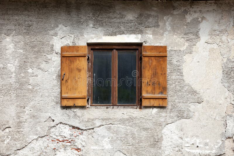 Old Window and Open Shutters on a Cracked Wall in Austria. Stock Image ...