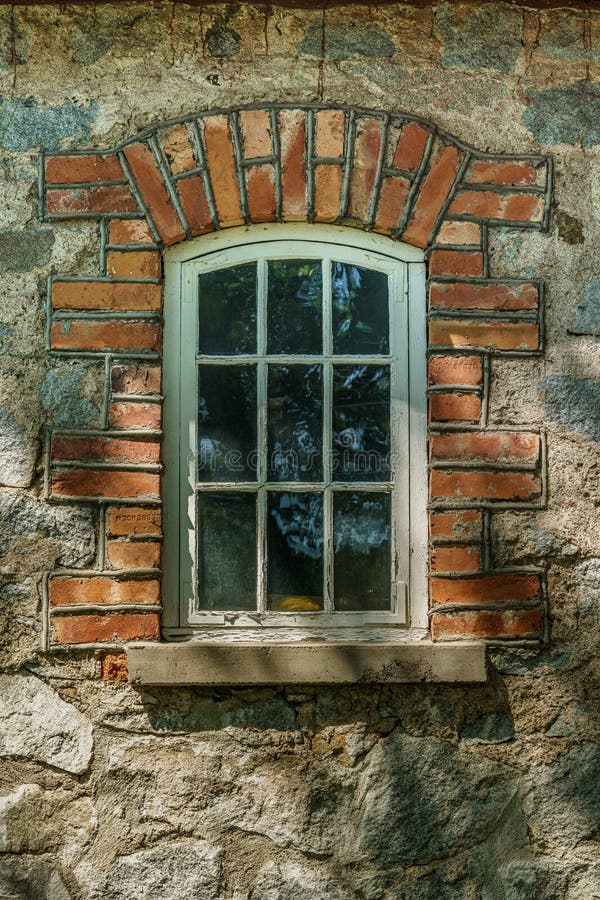 Old Window in a Stone Wall Framed by a Brick Pattern Stock Image ...