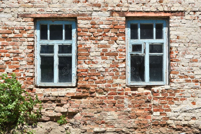 Old Small Windows of Blue Color and a Brick Wall. Exterior of an Old ...