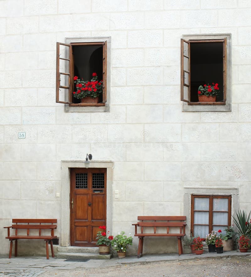 Old windows with flowers editorial photo. Image of city - 155004991