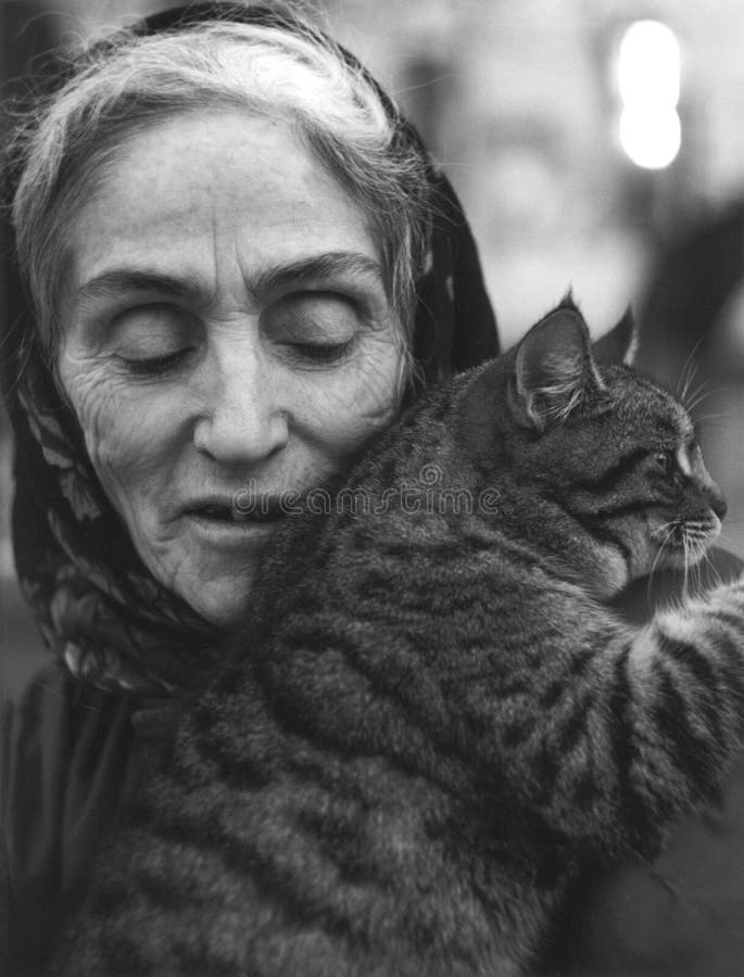 Old woman with cat editorial photo. Image of relation - 18399181