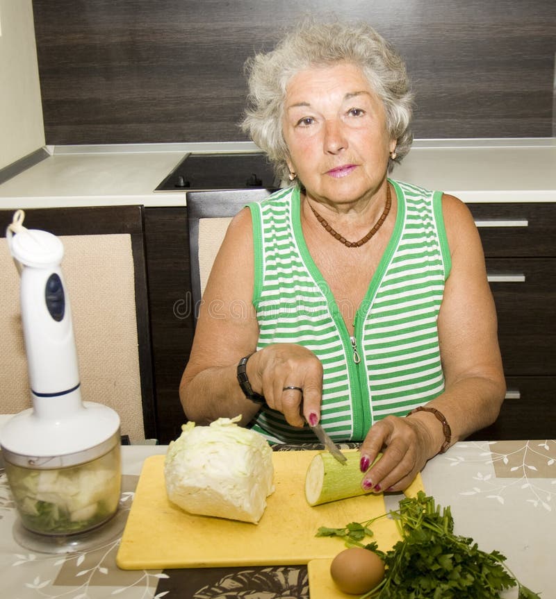 Old woman cooking stock photo. Image of dish, senior - 84007660