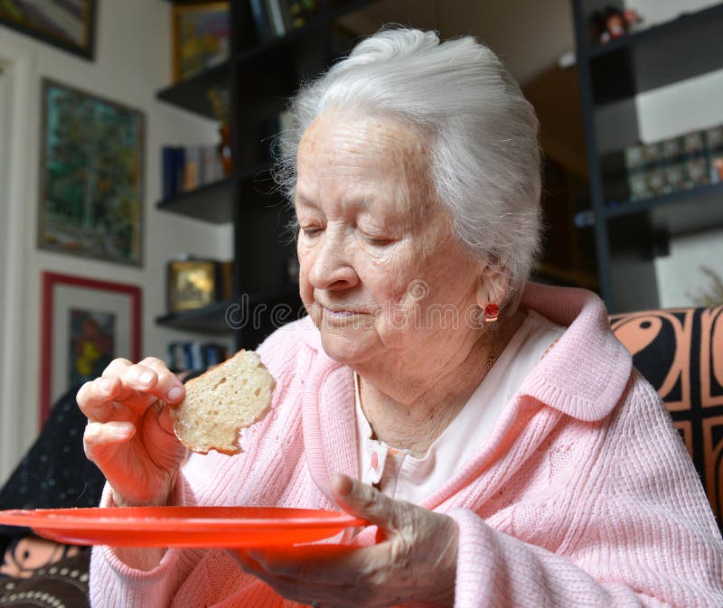Old Woman Eating a Slice of Bread Stock Image - Image of meal, home ...