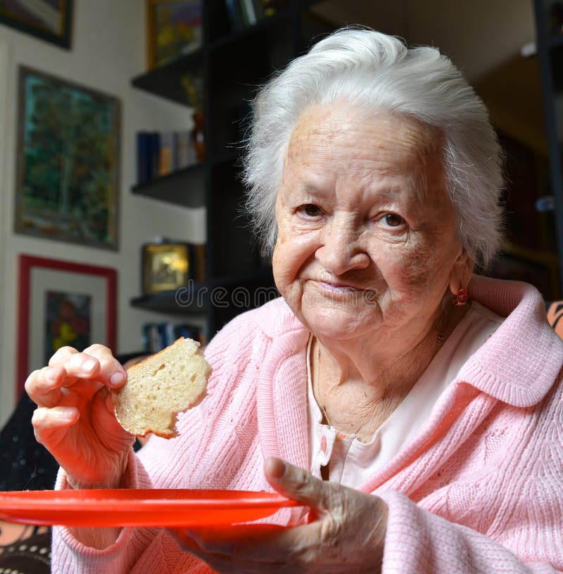Old Woman Eating a Slice of Bread Stock Image - Image of poor, sandwich ...