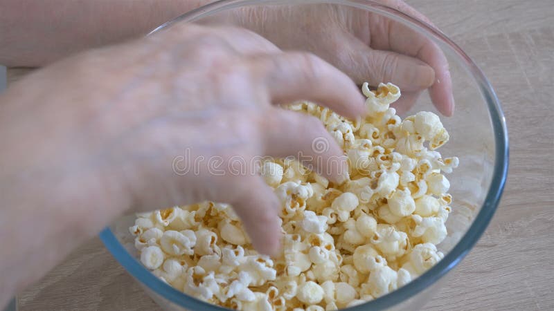 Old Woman Eats Popcorn. Closeup on Hands Stock Video - Video of grabs ...