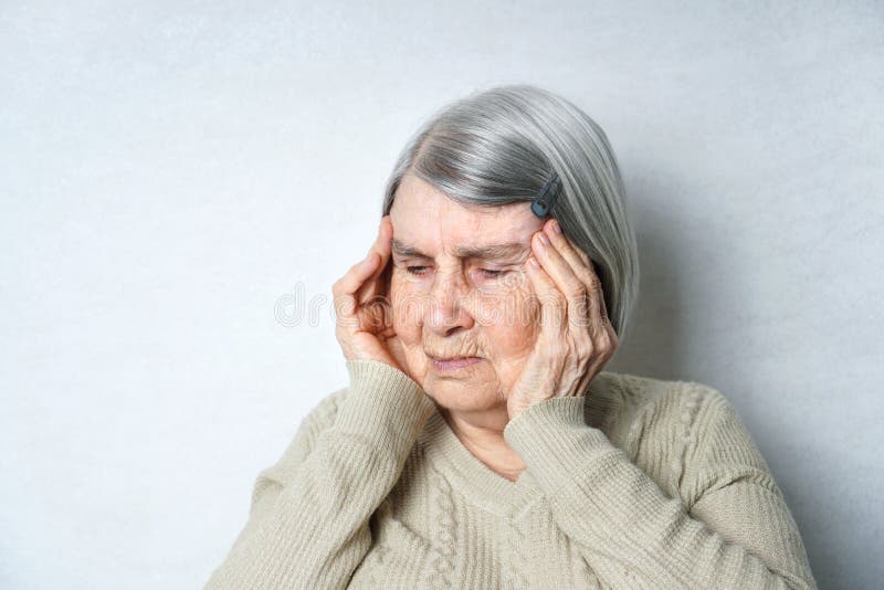 Old Woman Has a Headache. Aged Woman Holding Her Head Stock Image ...