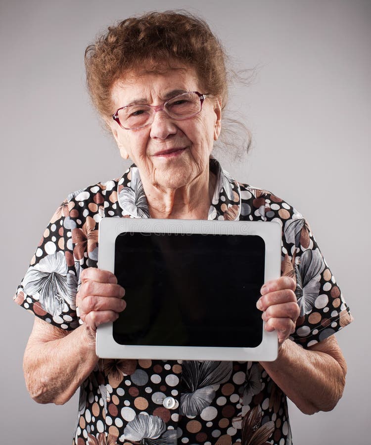 Old Woman Holding a Tablet in the Hands of Stock Photo - Image of ...