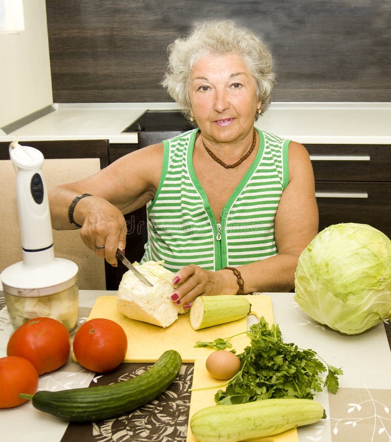 Old Woman In Kitchen Cooking Stock Image - Image of lady, elderly: 84010897