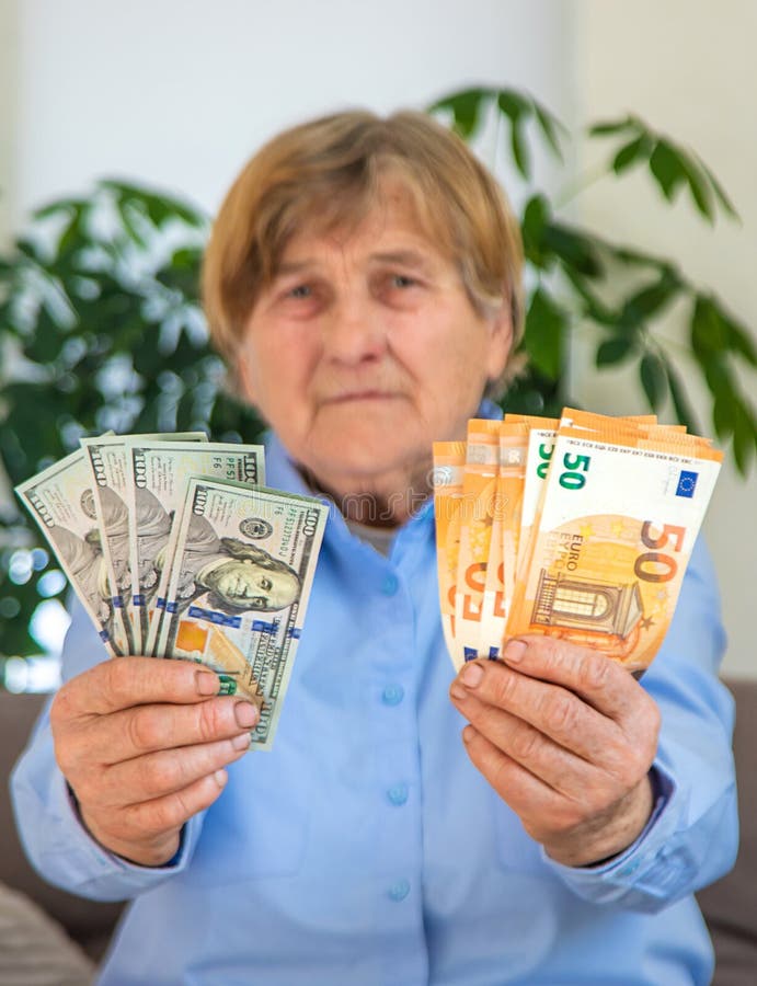 Old Woman with Money. Selective Focus Stock Photo - Image of paying ...