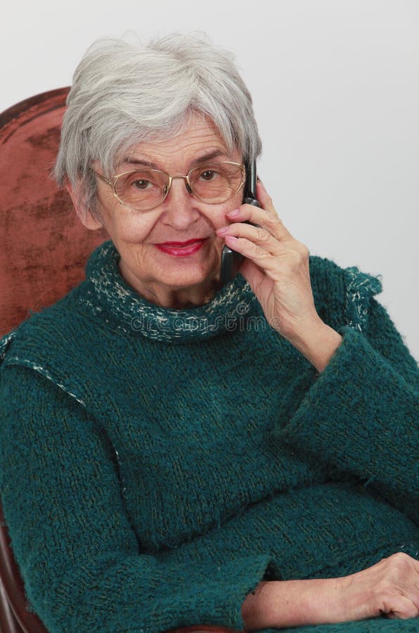 Old woman on the phone stock image. Image of portrait - 14146545