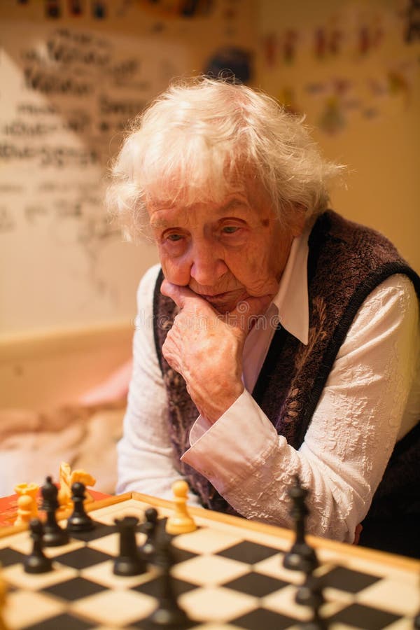 An Old Woman is Playing Chess. Hobby. Stock Image - Image of female ...