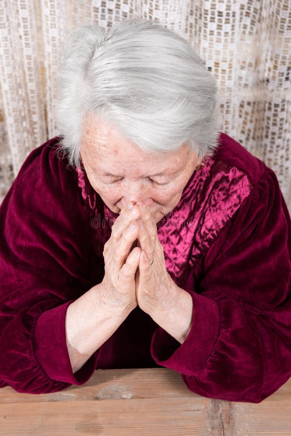 Old woman praying stock photo. Image of looking, senior - 31361372
