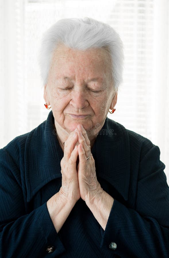 Old woman praying stock photo. Image of looking, senior - 31361372
