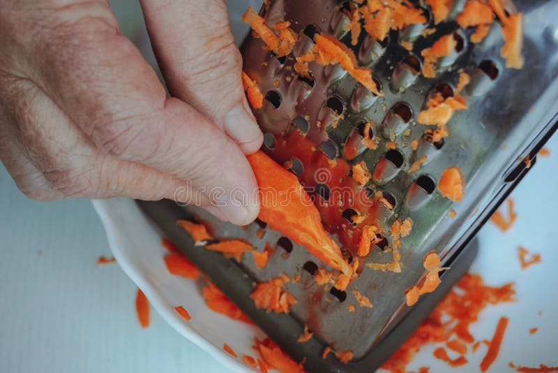 Old Woman Rubs Carrots on a Grater. Stock Photo - Image of chef ...