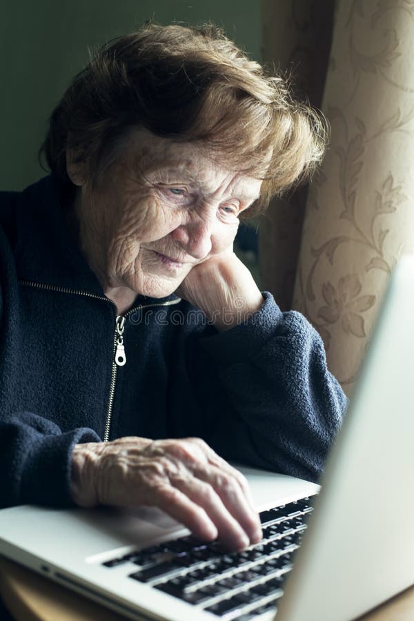 Old Woman Studying Working on the Computer in Her Home. Stock Image ...