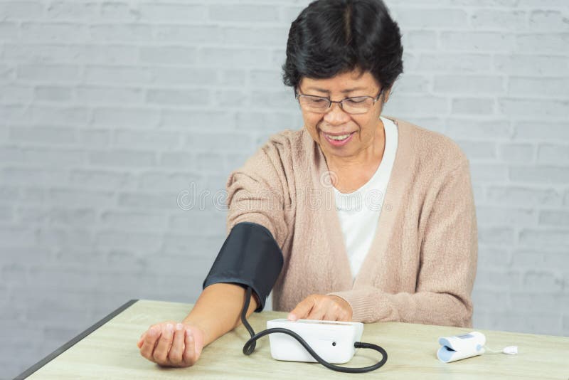 Old Woman With Tonometer Checking Blood Pressure Level Stock Image ...